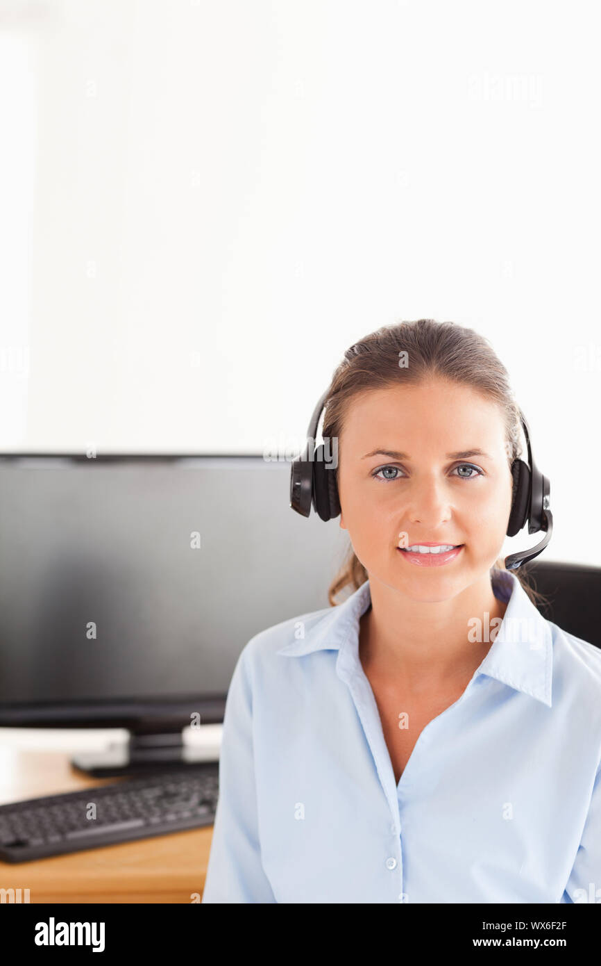 Secretary wearing a headset posing Stock Photo - Alamy