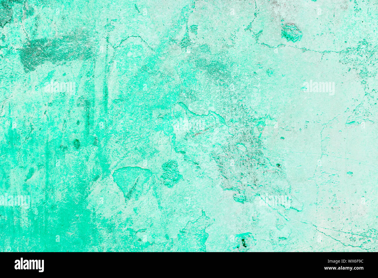 Old concrete wall fragment, painted and peeled stucco texture ...