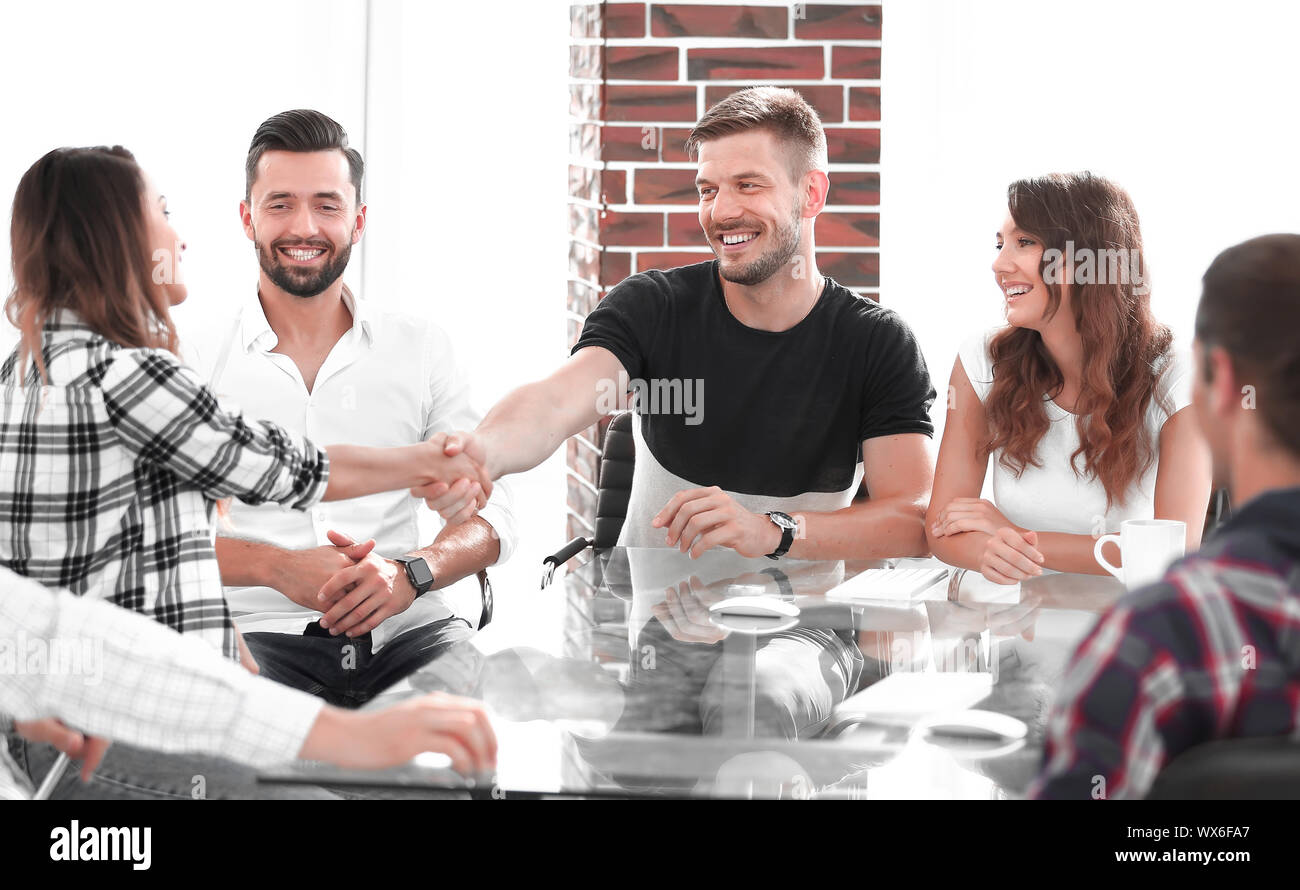 handshake colleagues at the workshop Stock Photo - Alamy