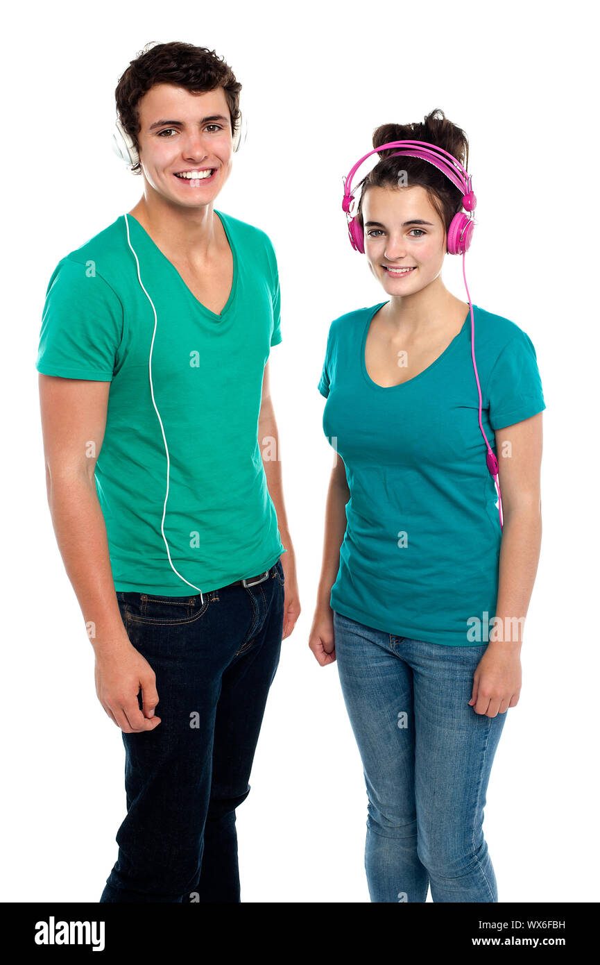 Friends enjoying music together via headphones. All against white ...