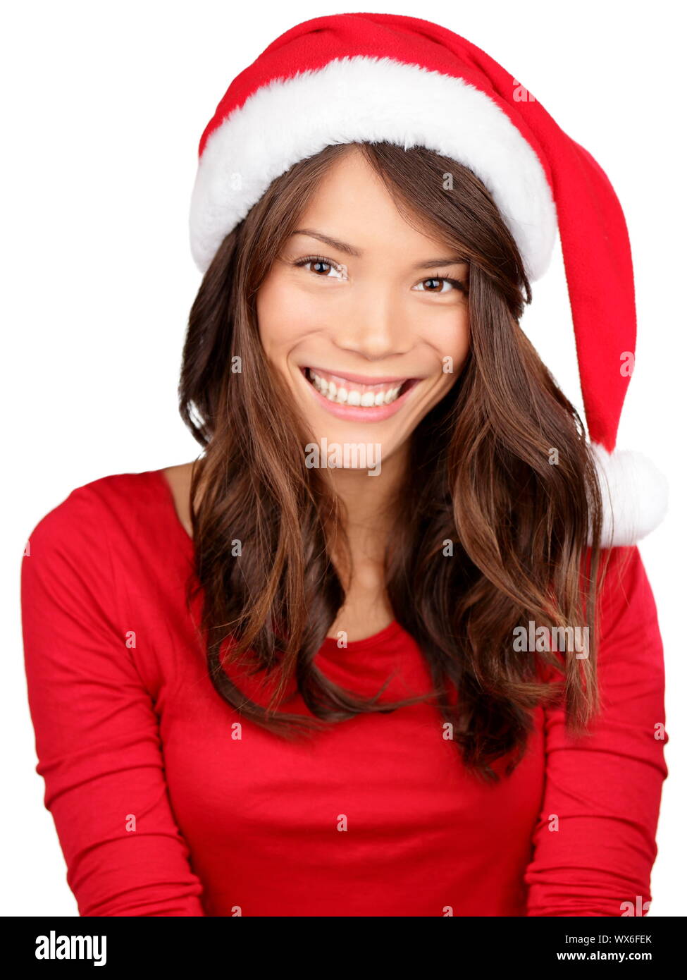 Christmas girl wearing santa hat Stock Photo - Alamy
