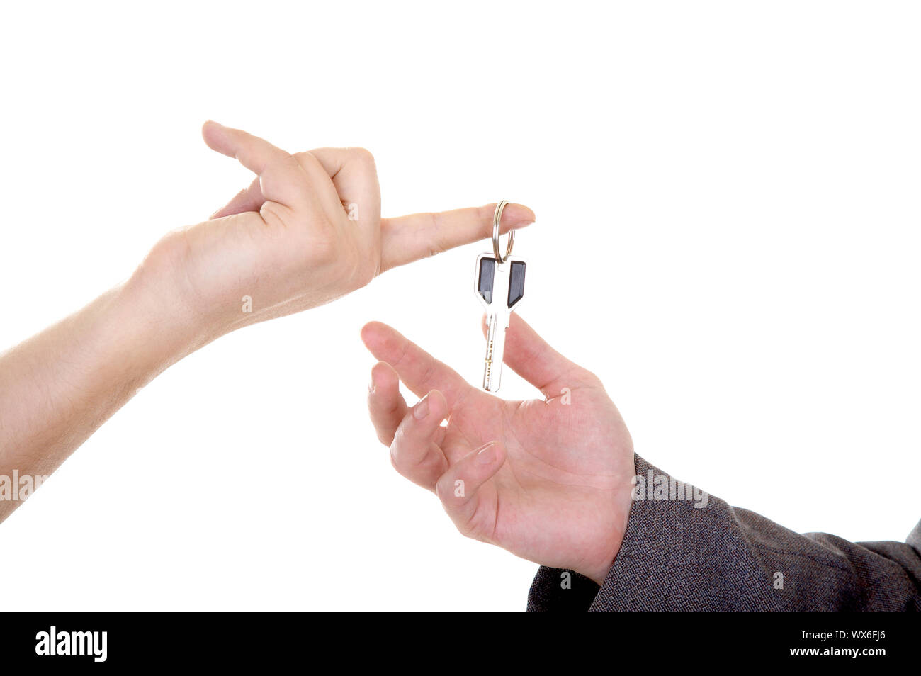 Man's hand with key isolated at the white background Stock Photo - Alamy