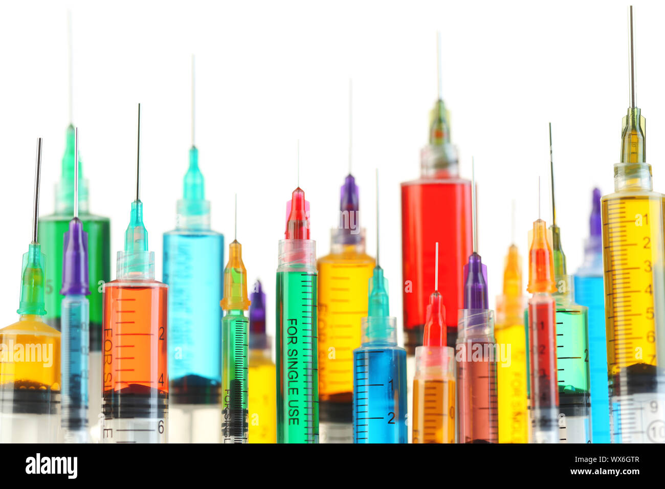 Collection of bright and colorful syringes Stock Photo - Alamy