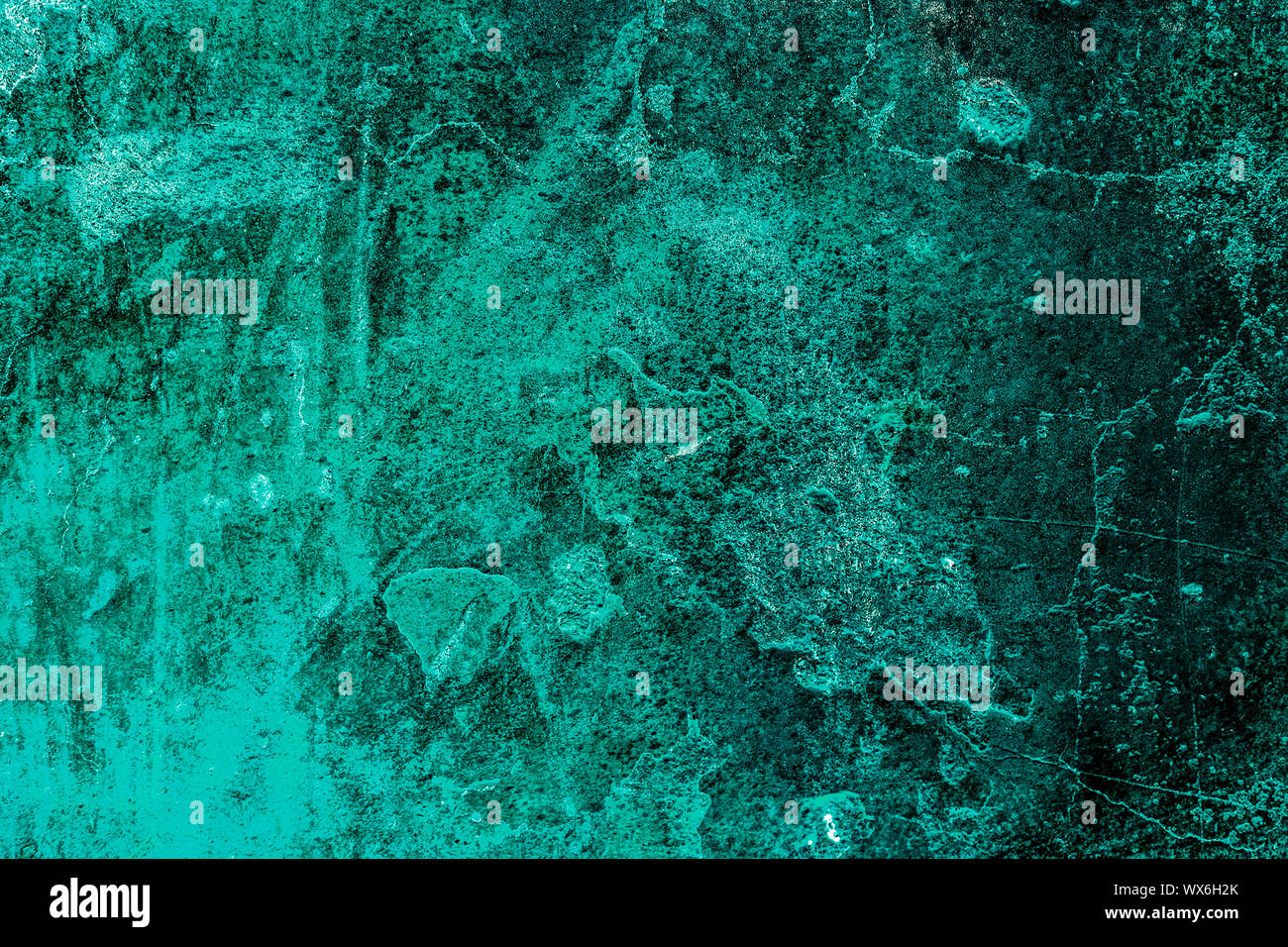 Old concrete wall fragment, painted and peeled stucco texture ...