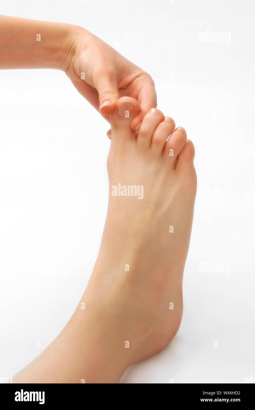 reflexotherapy foot massage on the white background Stock Photo - Alamy