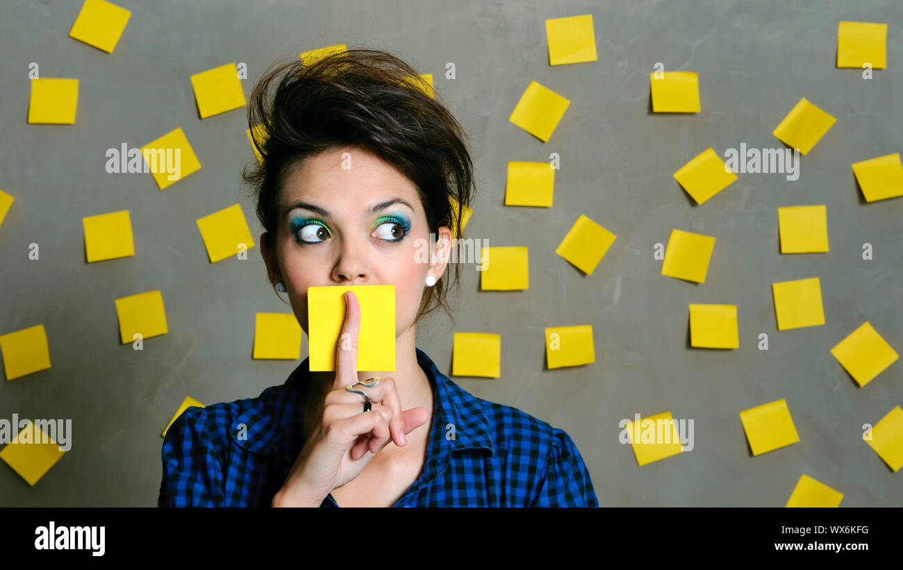 Pretty fashion model with hundreds of post it notes Stock Photo - Alamy