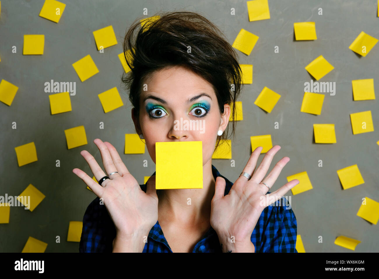 Pretty fashion model with hundreds of post it notes Stock Photo - Alamy