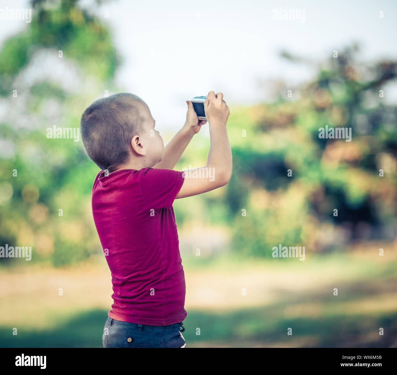 Little cute boy with camera Stock Photo - Alamy