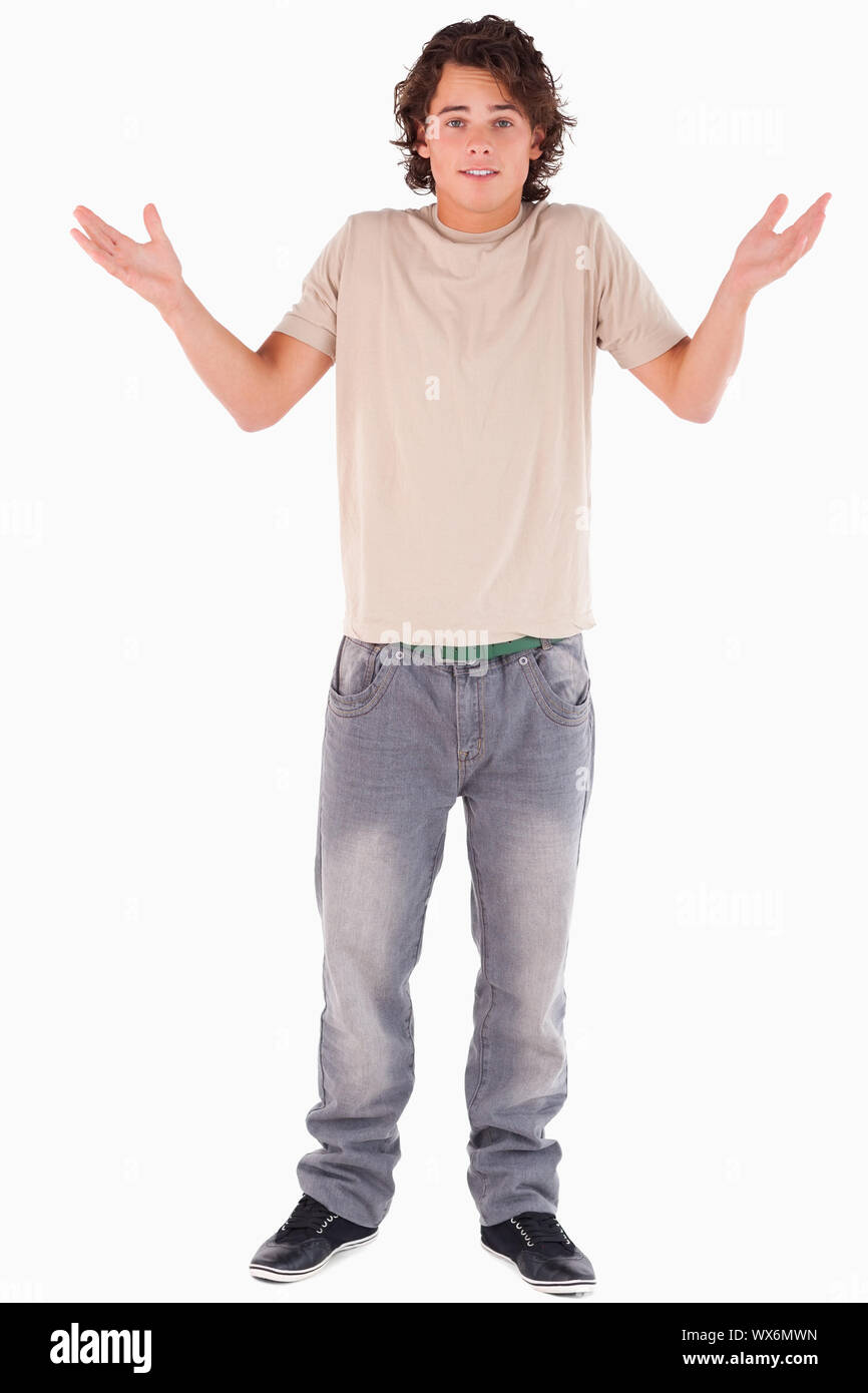 Clueless man posing in a studio Stock Photo - Alamy