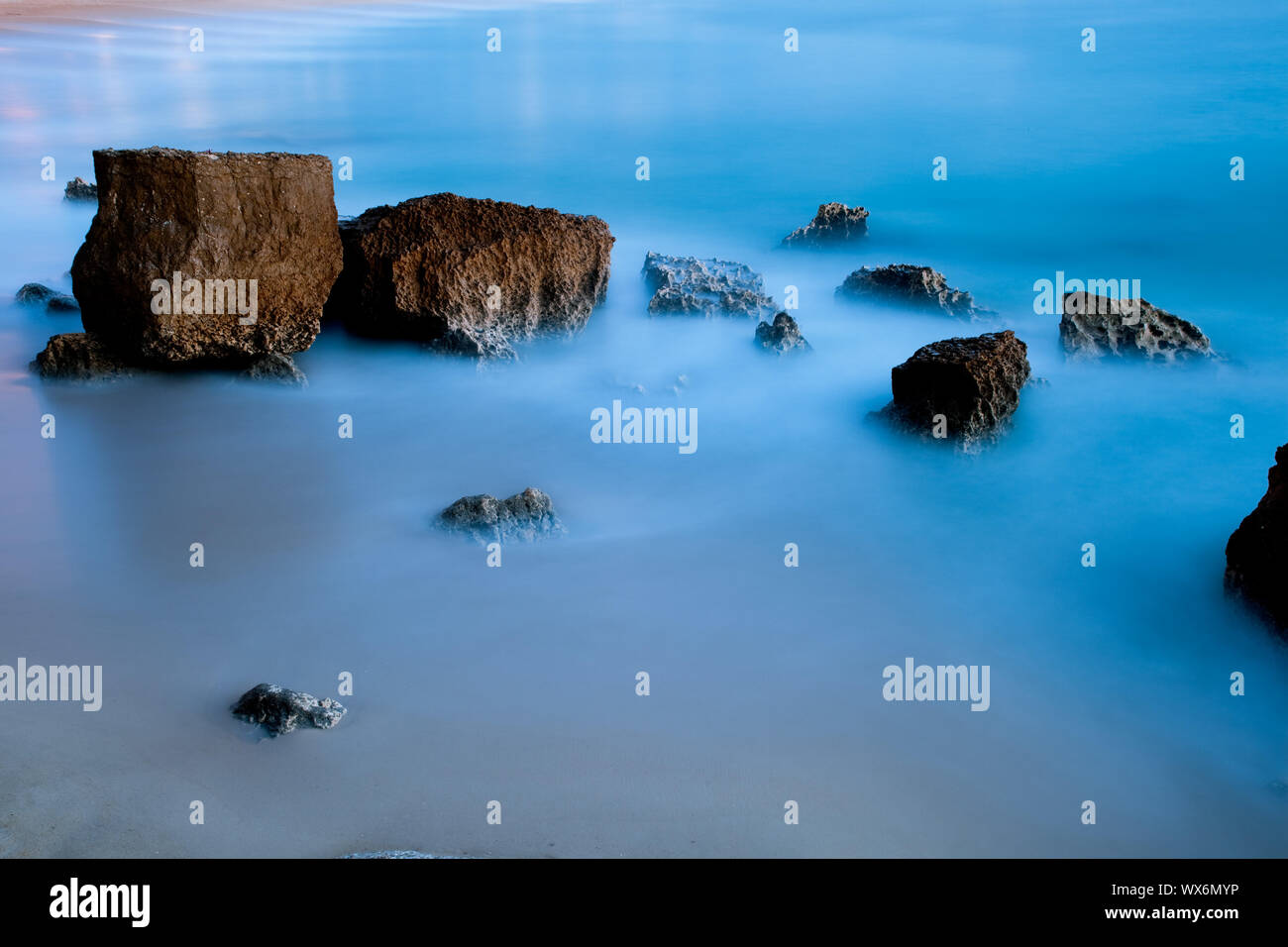 Landscape picture of rocks on the beach Stock Photo - Alamy