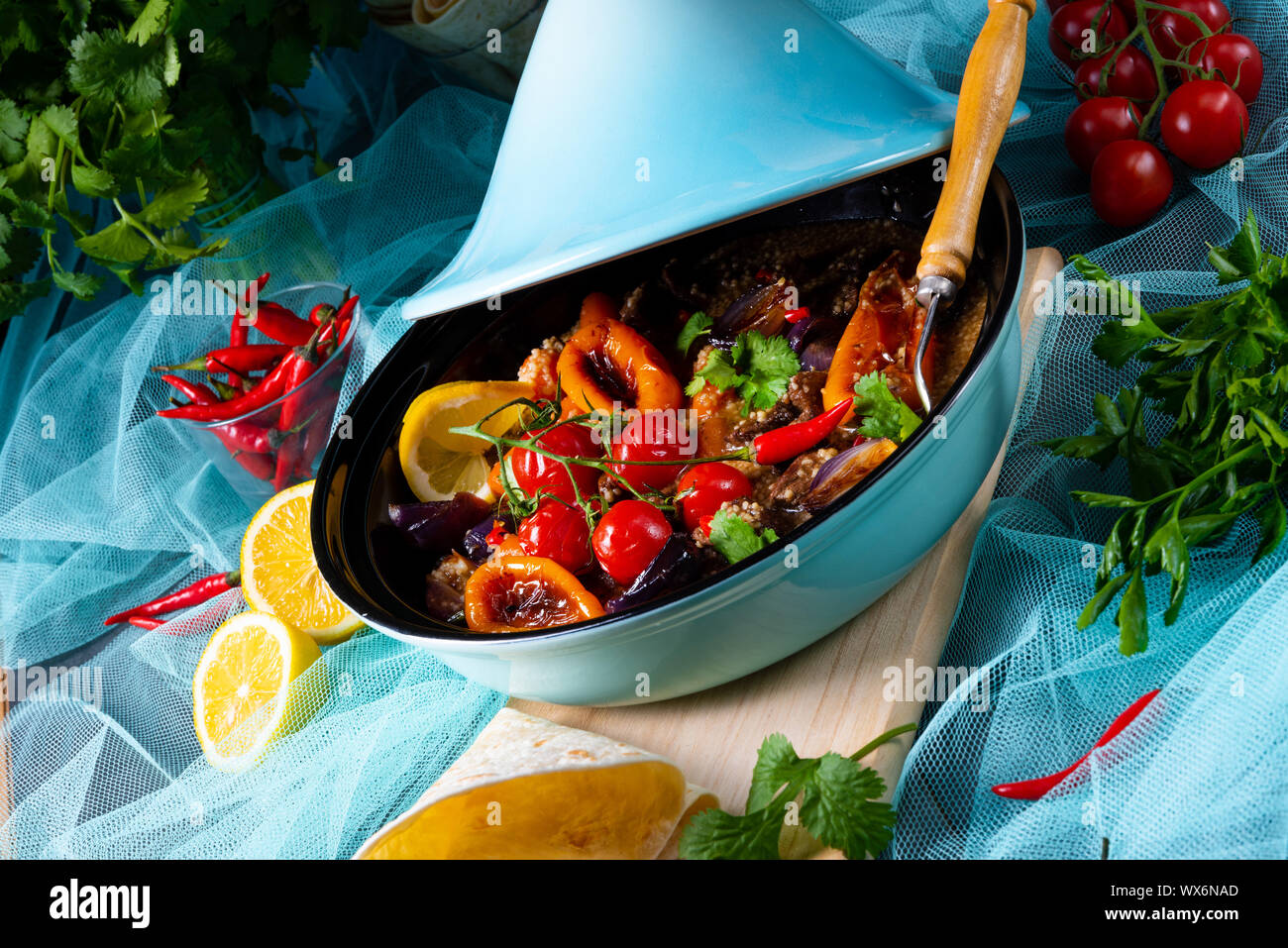 Tasty spicy beef with various vegetables cooked in tagine Stock Photo ...