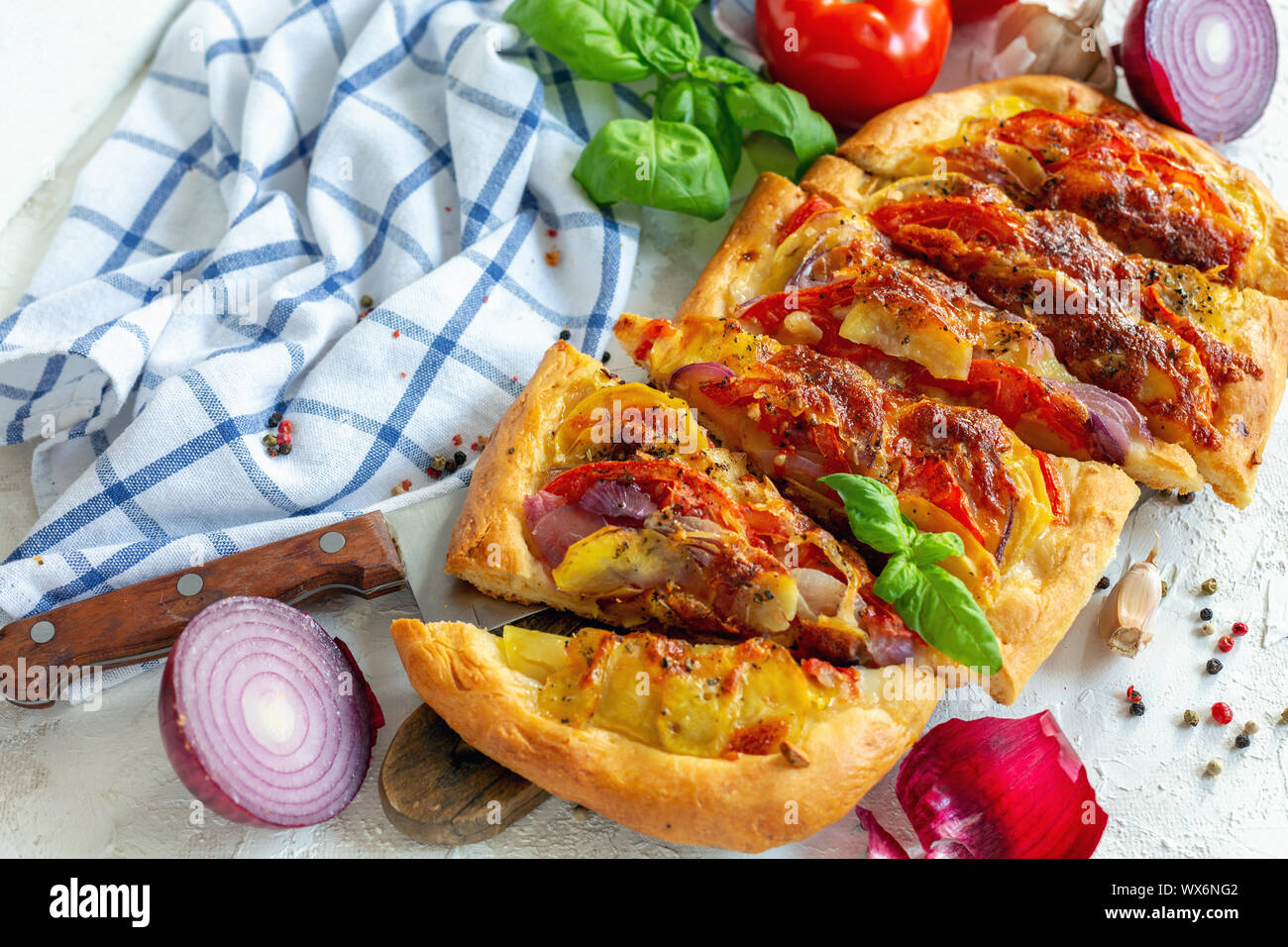 Vegetable pie with potatoes, onions and tomato Stock Photo - Alamy