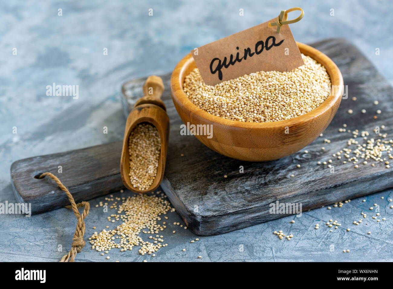 Raw white quinoa in a wooden bowl Stock Photo - Alamy