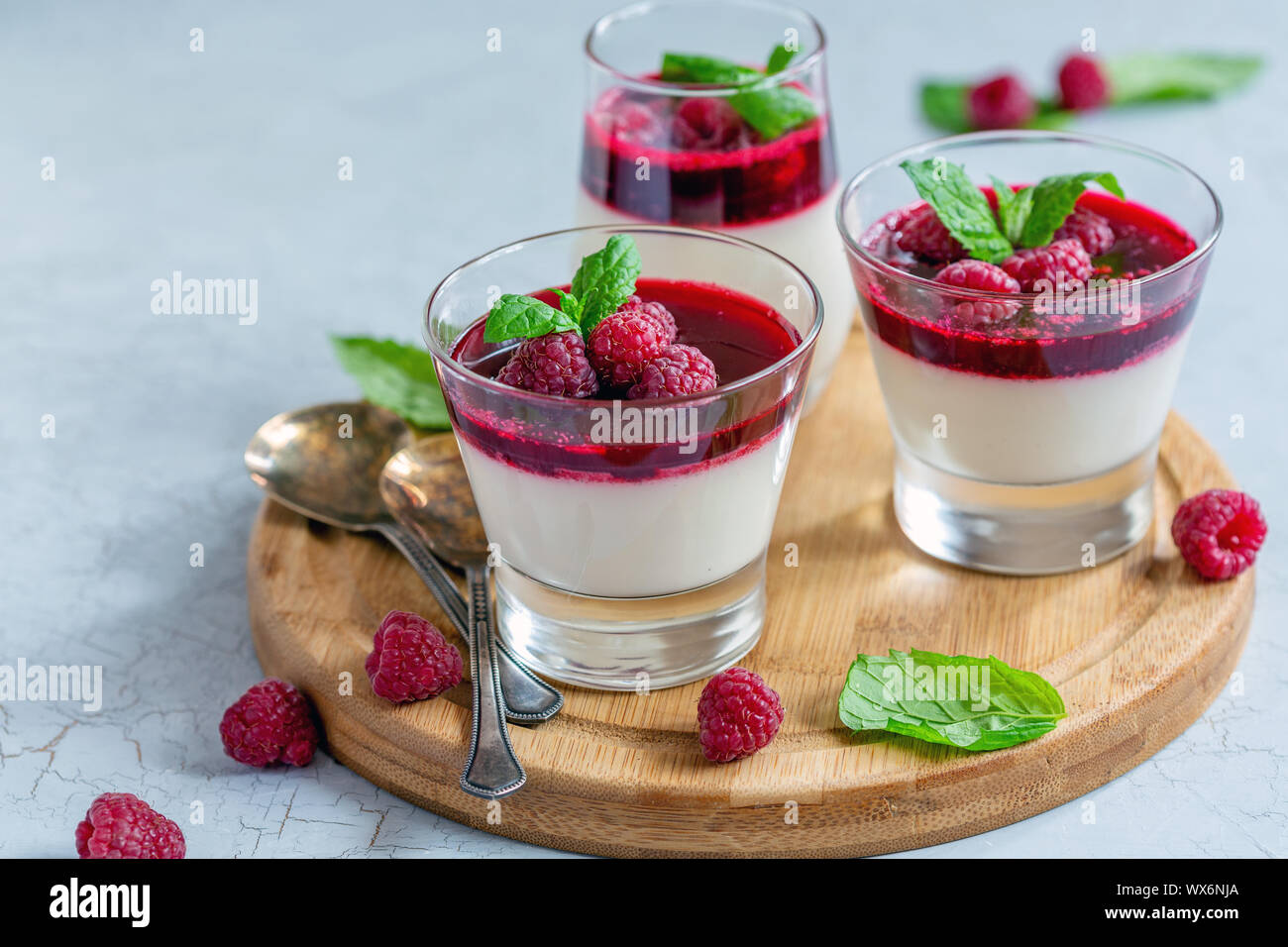 Vanilla Panna cotta with raspberry and mint Stock Photo - Alamy