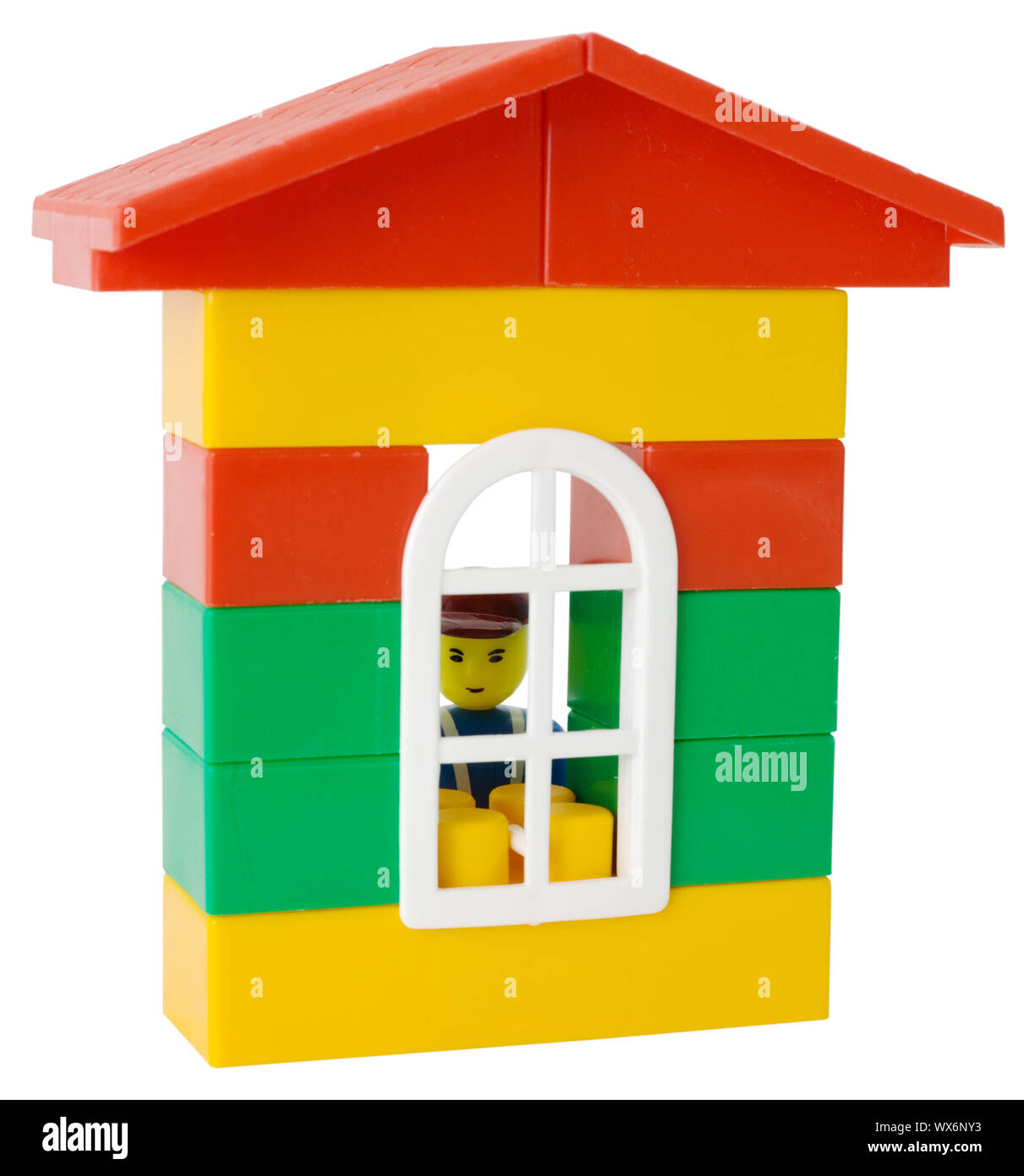 Little man and toy house on the white background Stock Photo - Alamy