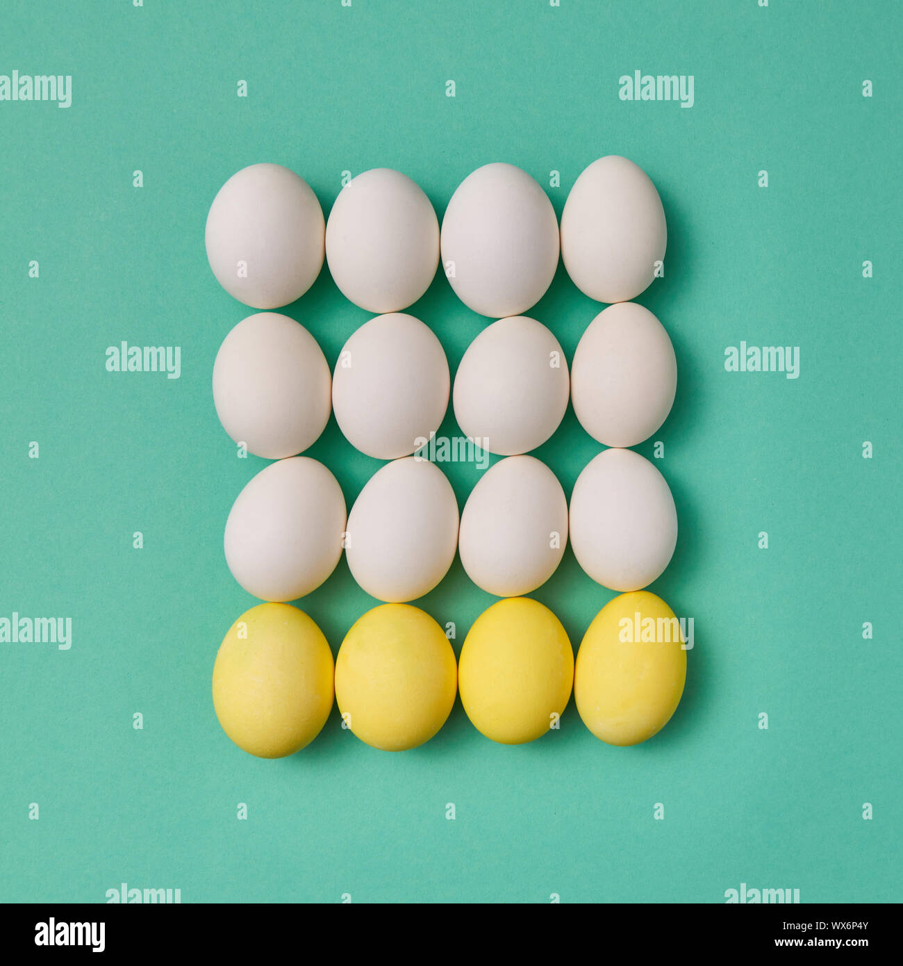 Pattern in the form of a square of painted yellow and white eggs on a ...