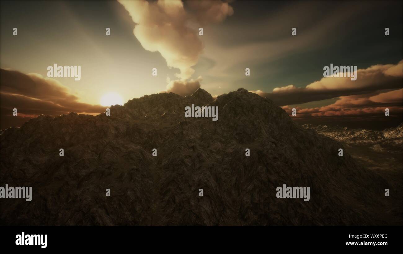 Sun Rays over Mountains in a Valley Stock Photo - Alamy