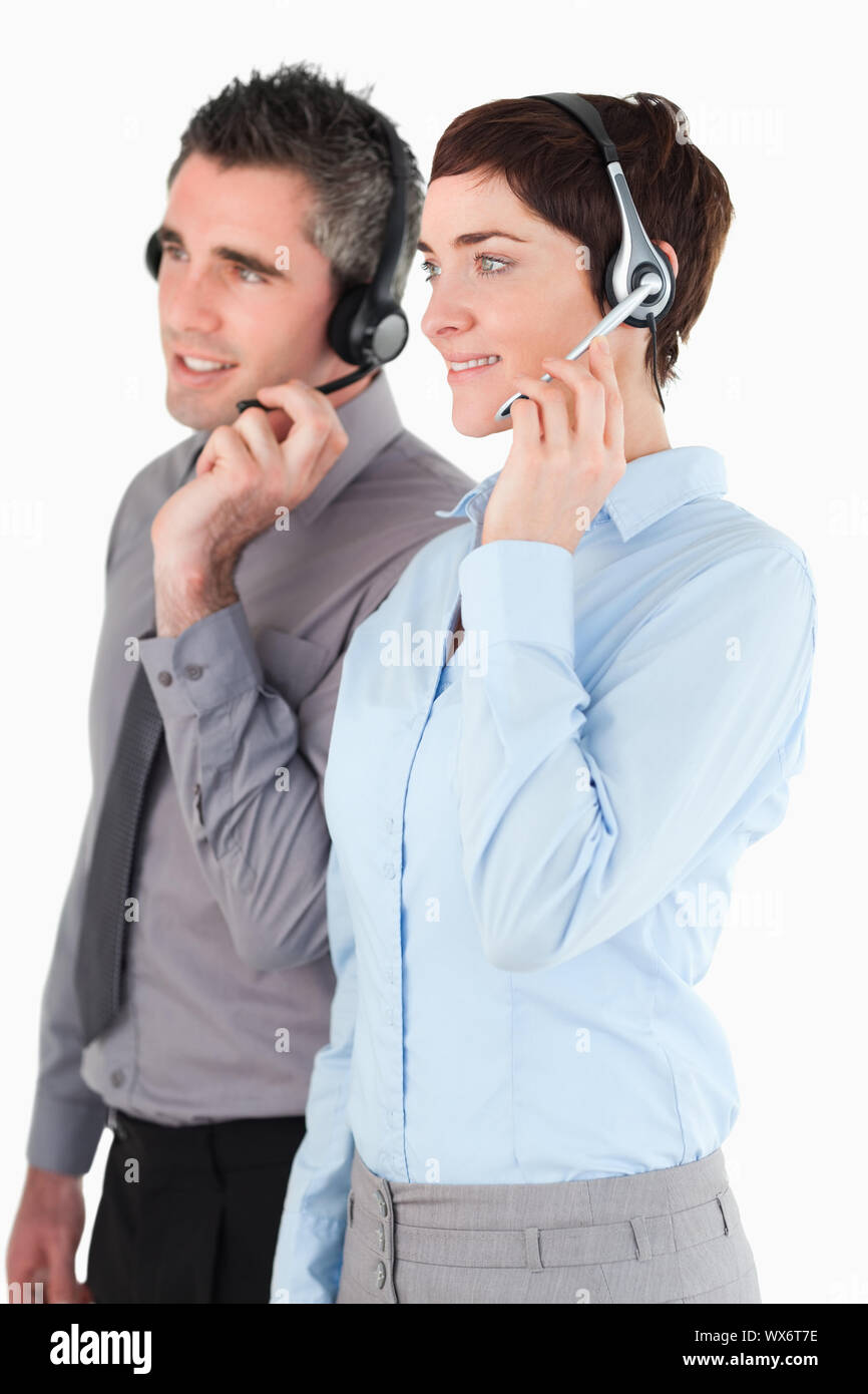Portrait of operators using headsets against a white background Stock ...