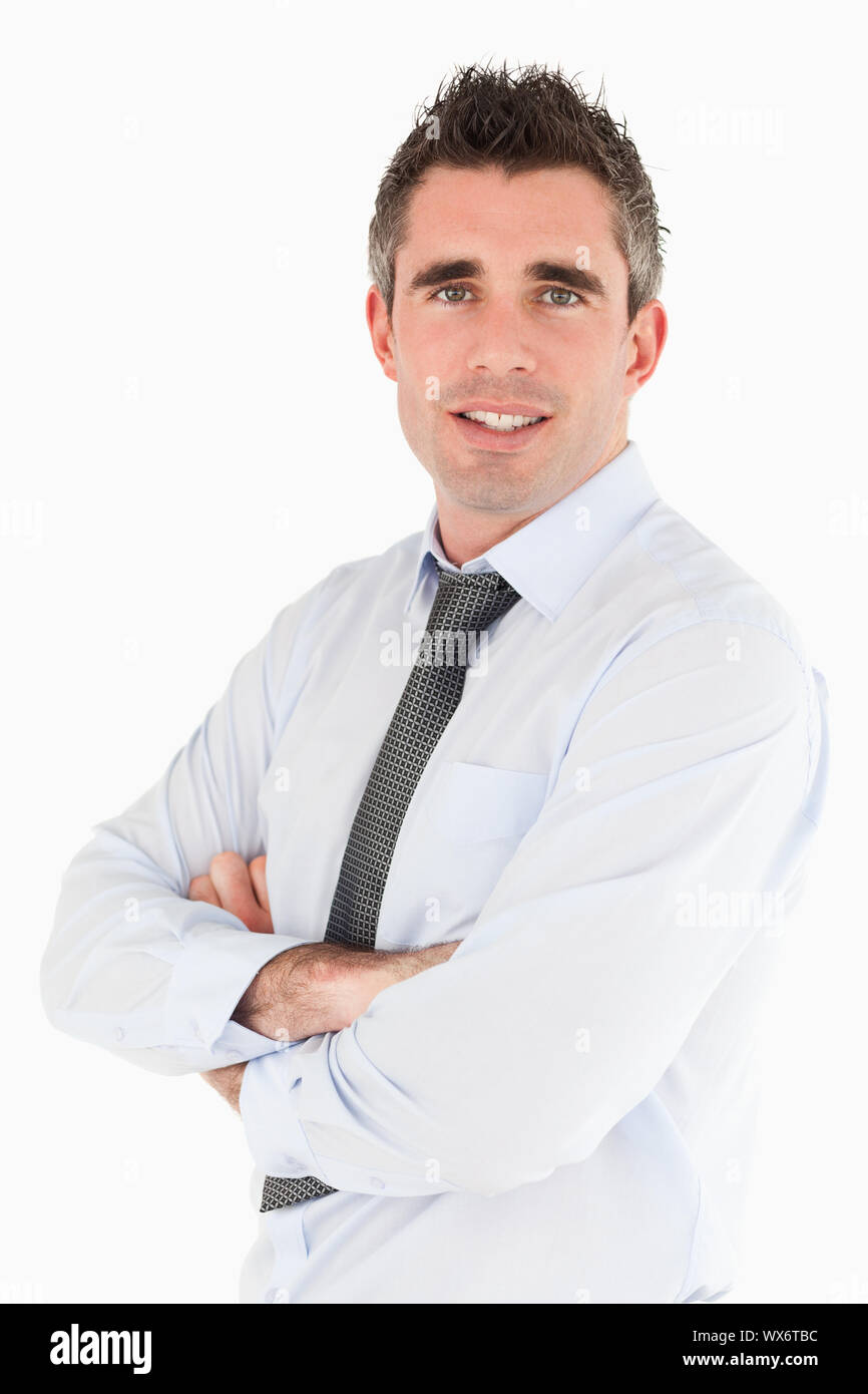 Portrait of a smiling salesperson posing against a white background ...