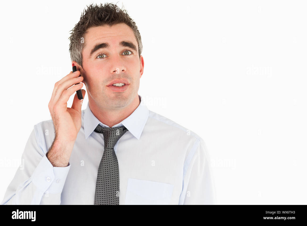Office worker making a phone call against a white background Stock ...