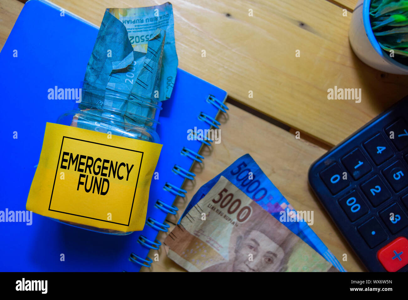 Emergency Fund text on a Jar isolated on office desk background Stock ...