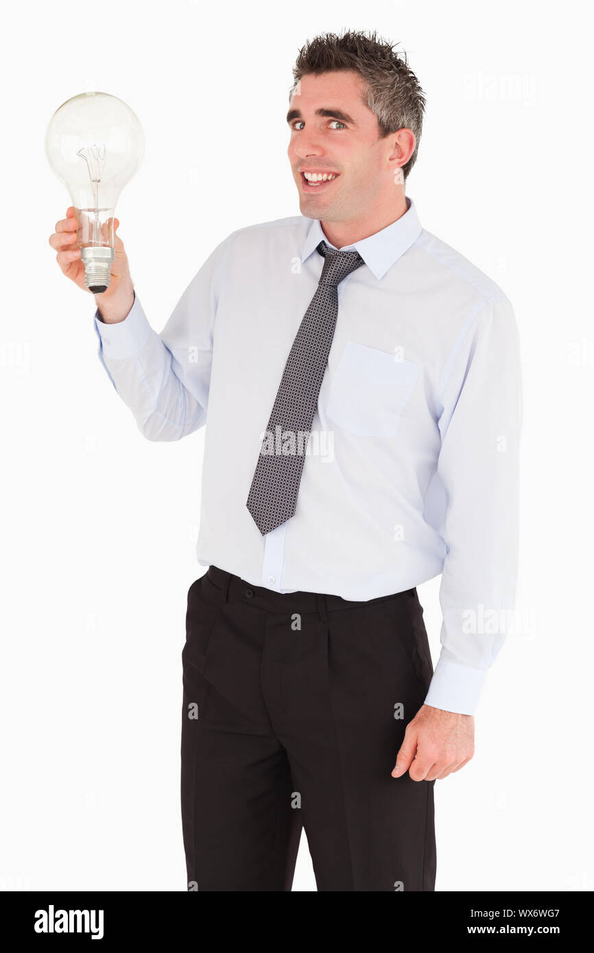Smiling entrepreneur holding smart Cut Out Stock Images & Pictures - Alamy