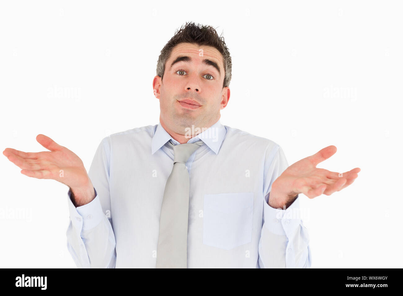 Clueless office worker posing against a white background Stock Photo ...
