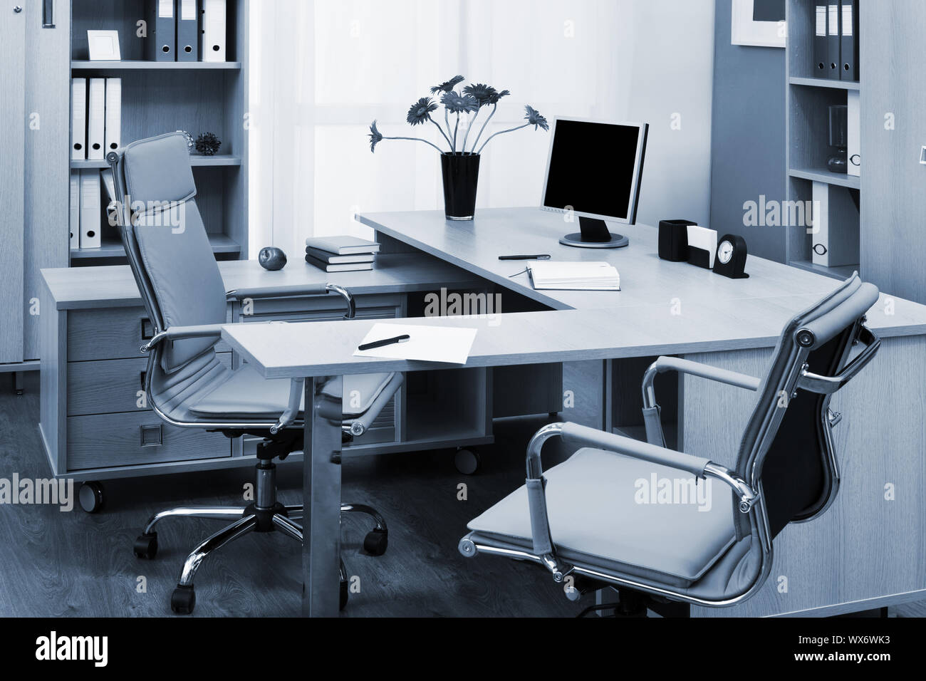 monitor on desk at modern office Stock Photo - Alamy