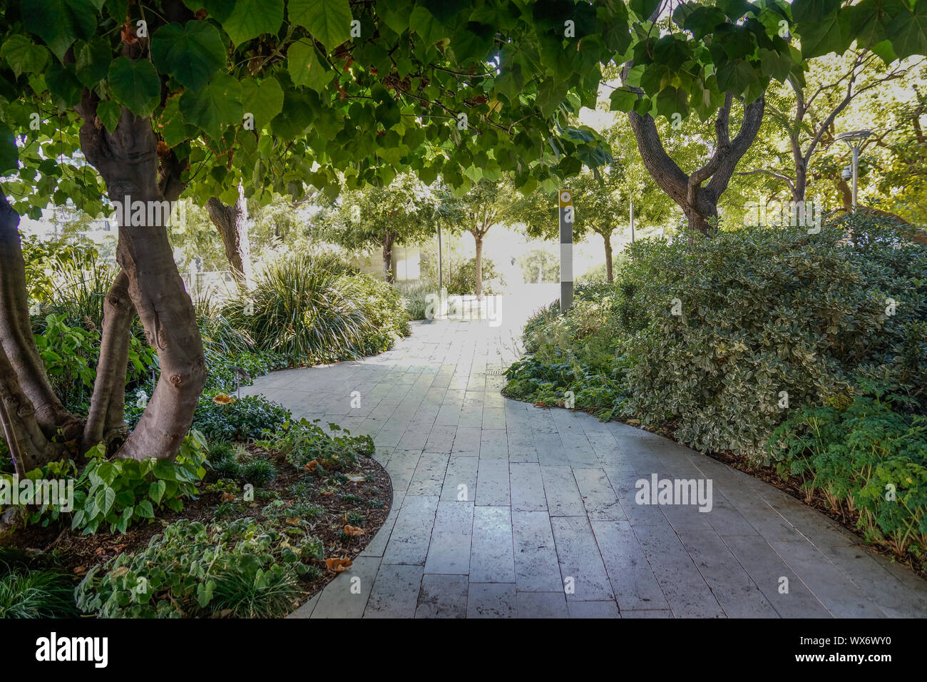 la urban park crooked path Stock Photo - Alamy