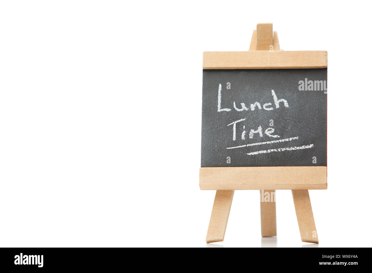 Chalkboard with the words lunch time written on it isolated against a ...