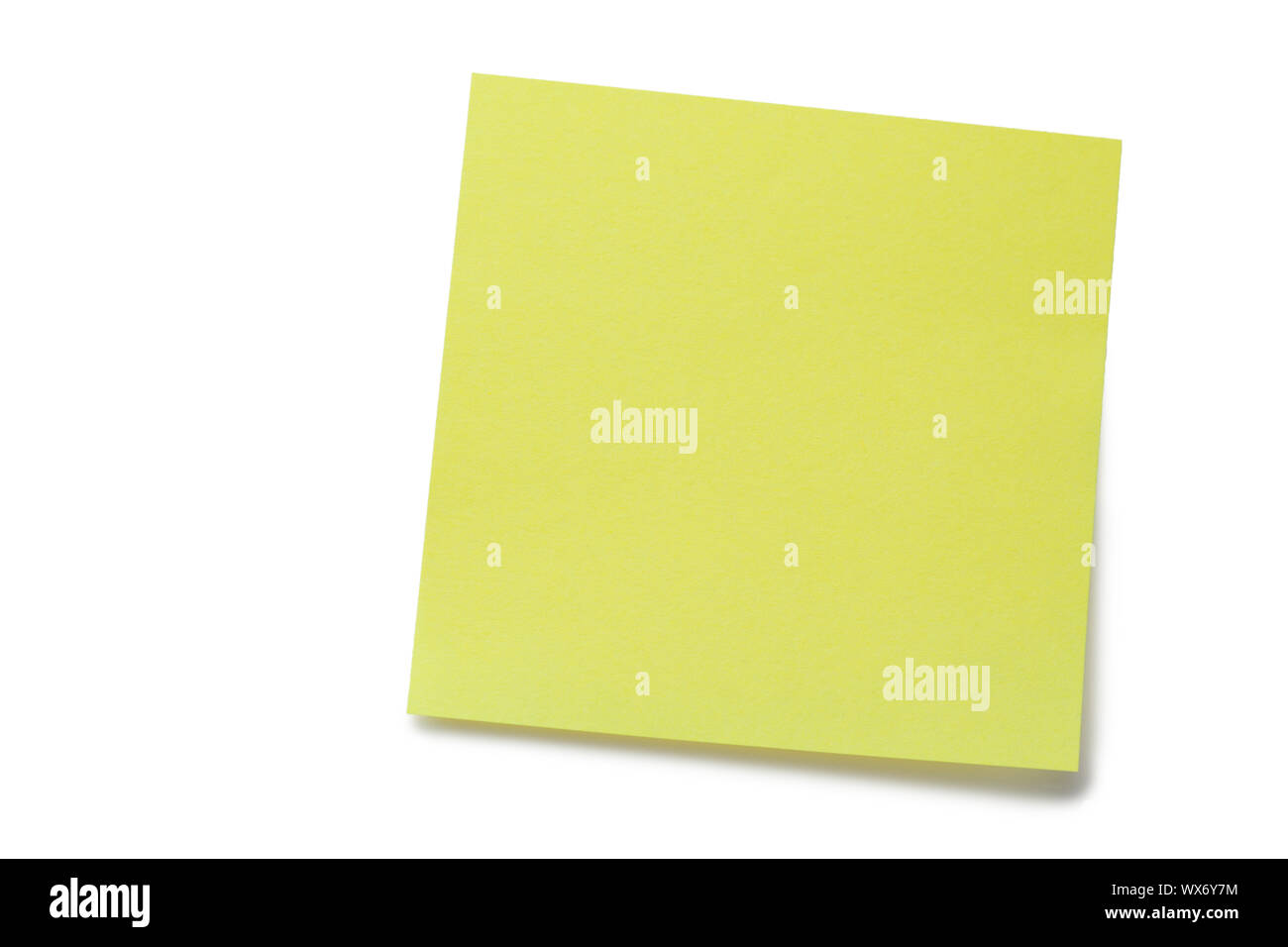 Yellow post-it on a white background Stock Photo - Alamy