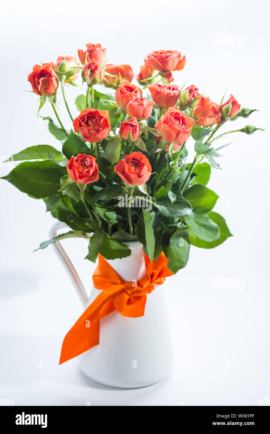 orange roses in vase Stock Photo - Alamy