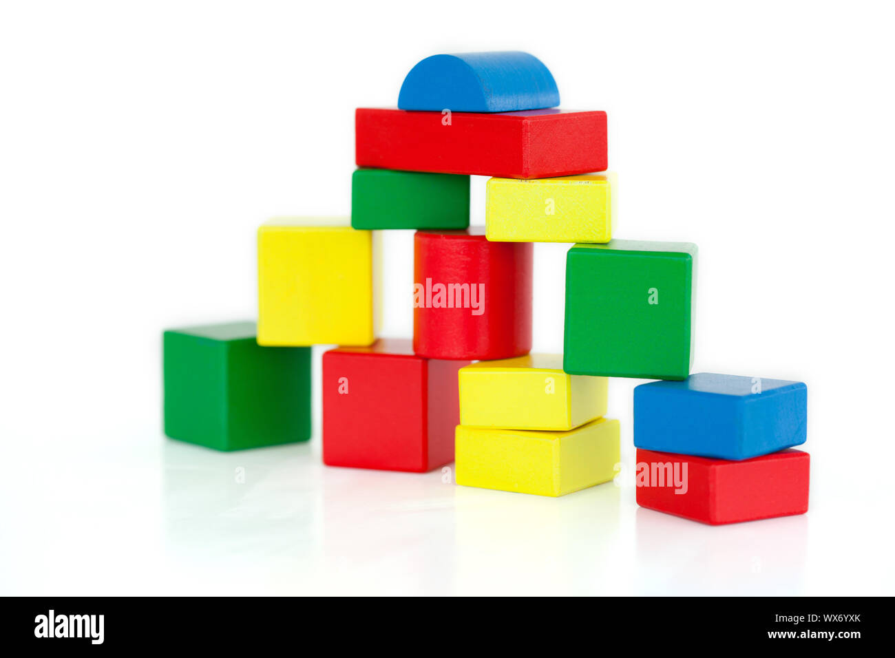 Wooden building blocks on a white background Stock Photo - Alamy