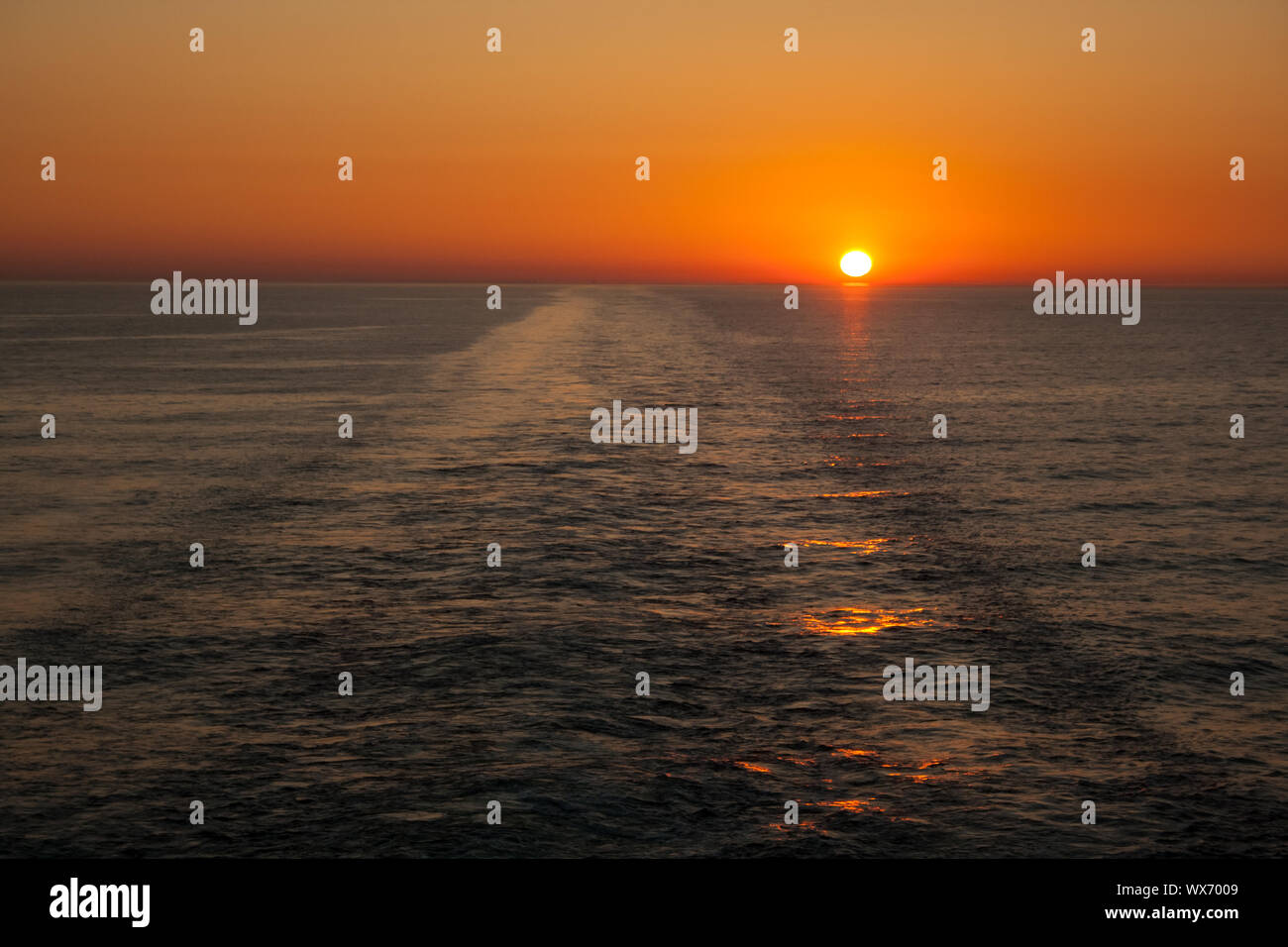 Trace from the high-speed ship and sunset Stock Photo - Alamy