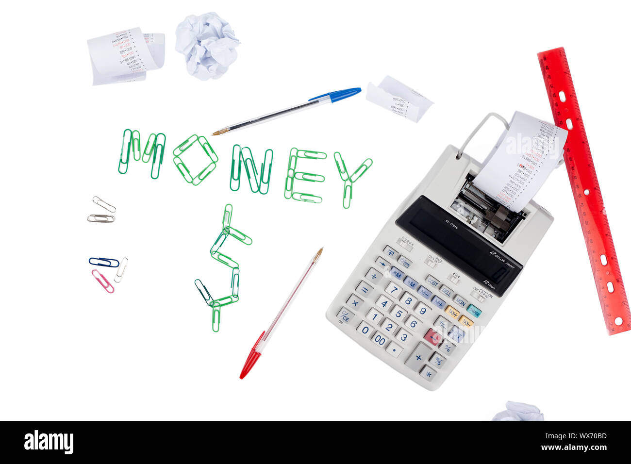 Scattered receipt, pen, ruler, calculator and money word over a white ...