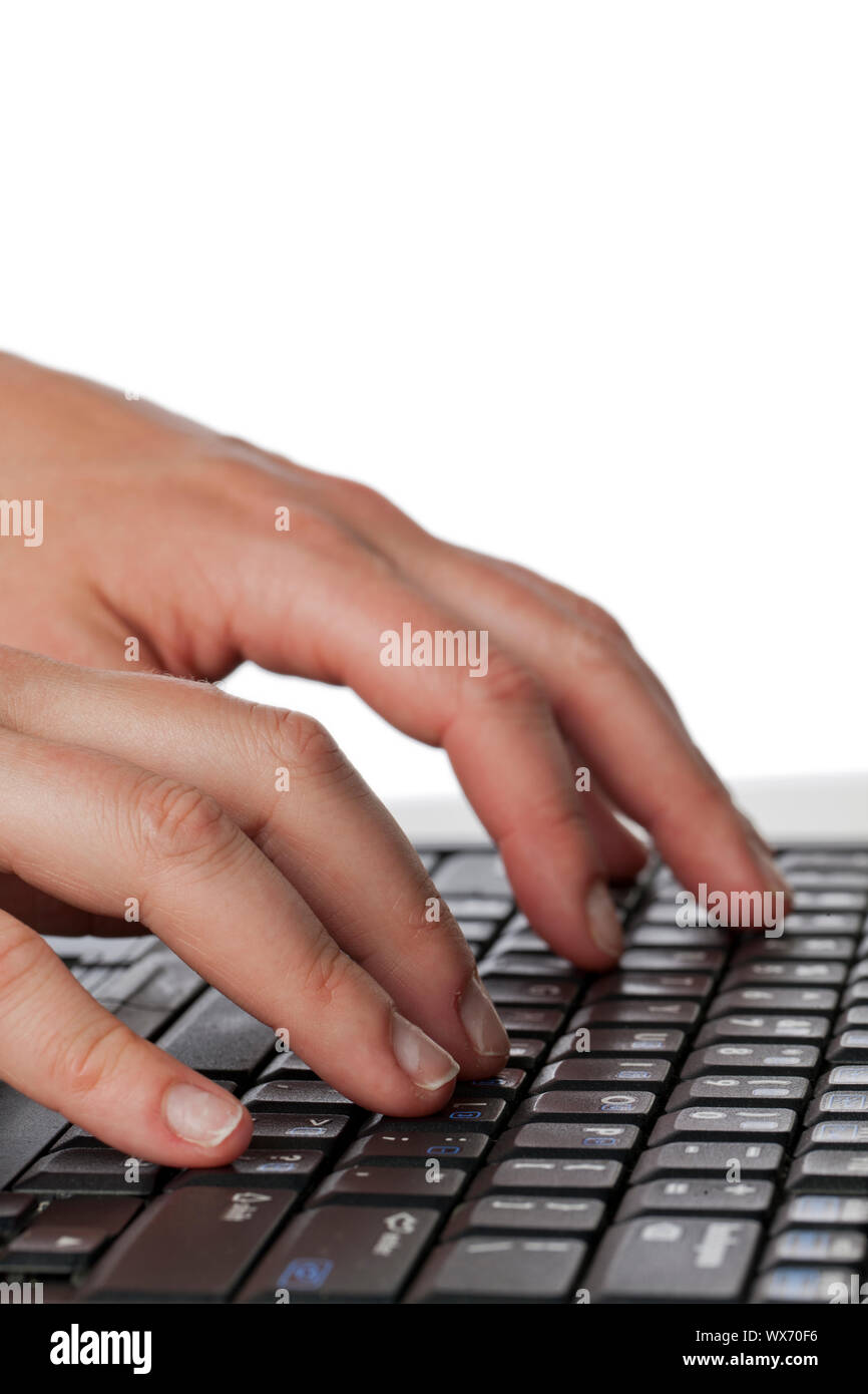 Close up image of human hand typing on laptop against white background ...