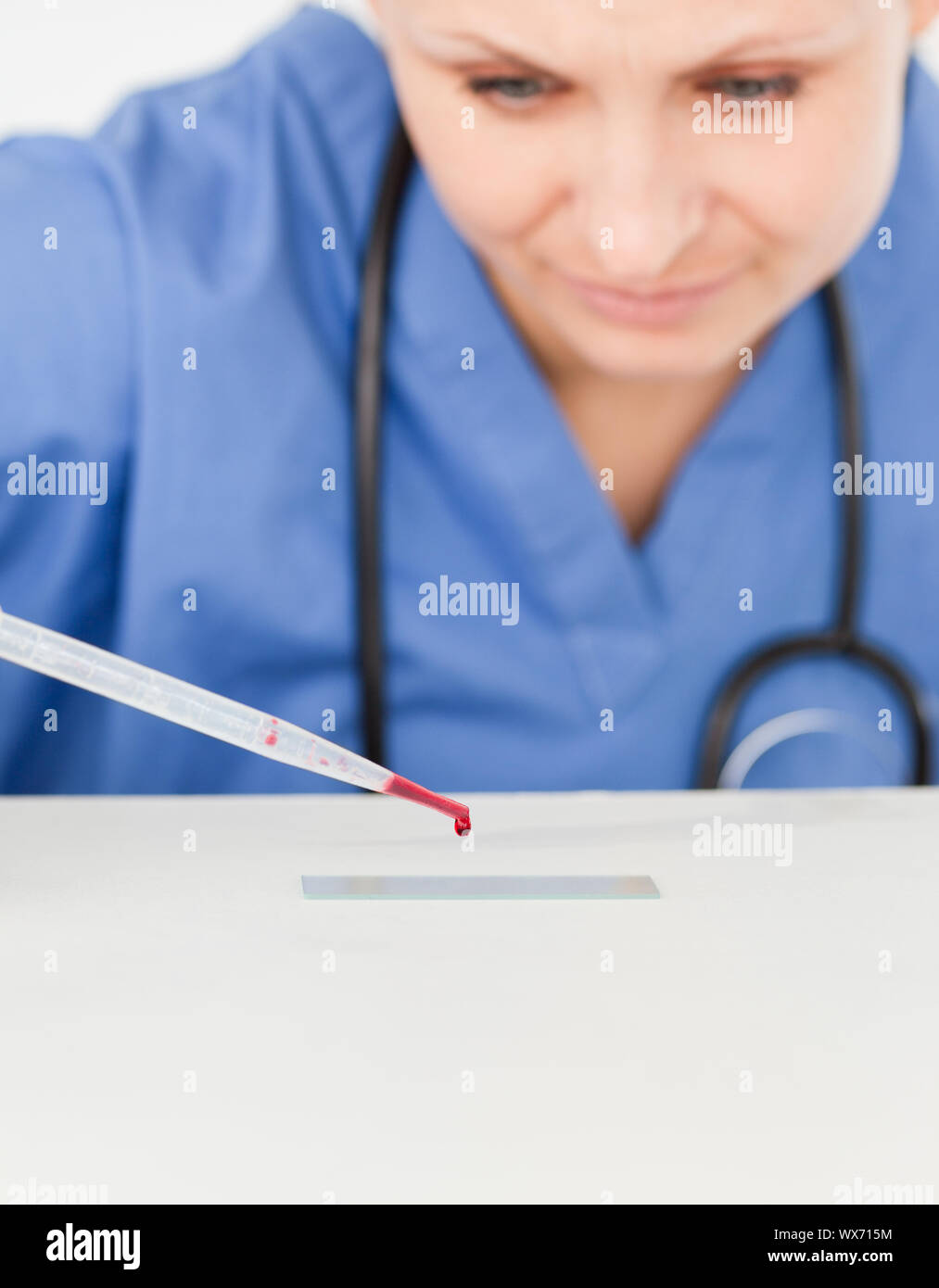 Female scientist preparing a slide for a microscope in a lab Stock ...