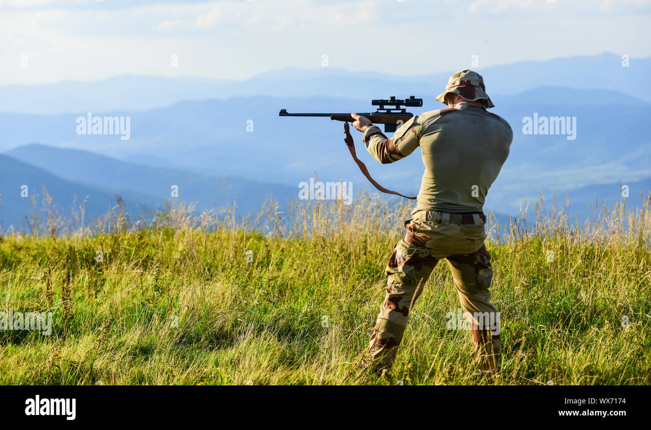 Nice shot. Army forces. Hunter hold rifle. Hunter mountains landscape ...