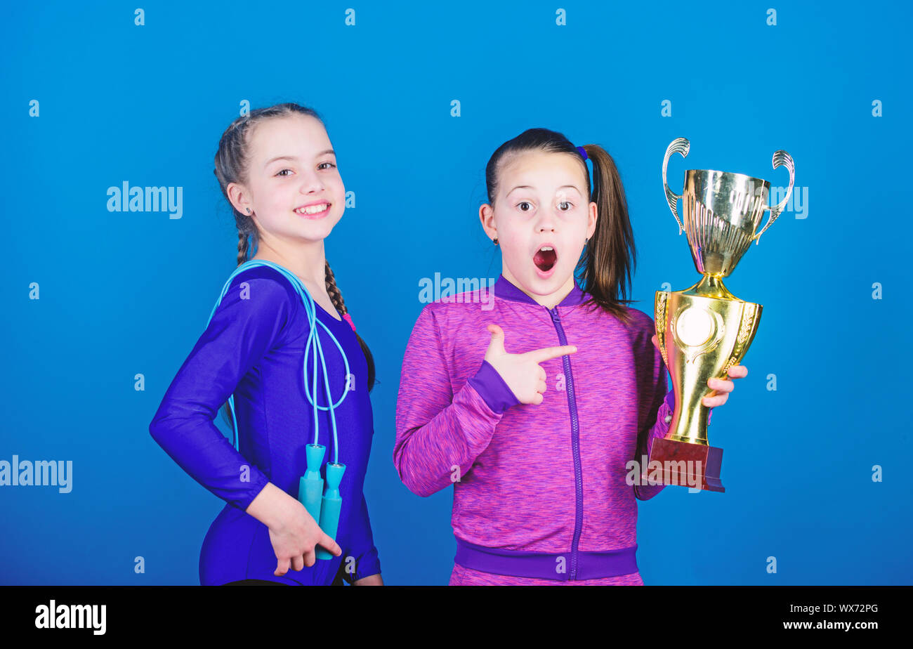 Deserved award. Girls athletic kids celebrate victory. Athletic girls ...