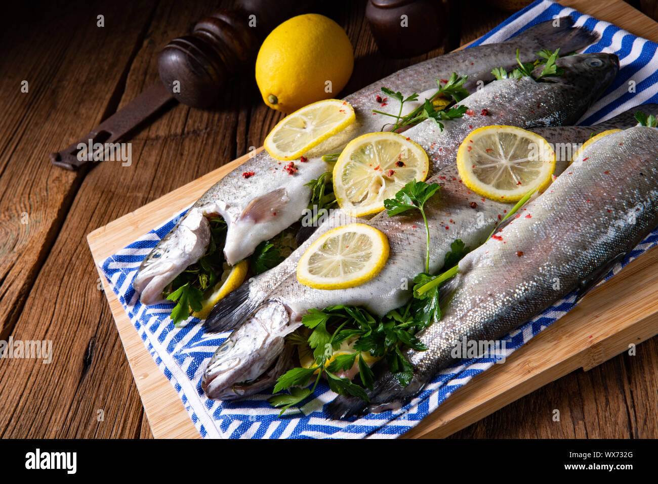 fresh trout with lemon and different herbs Stock Photo - Alamy