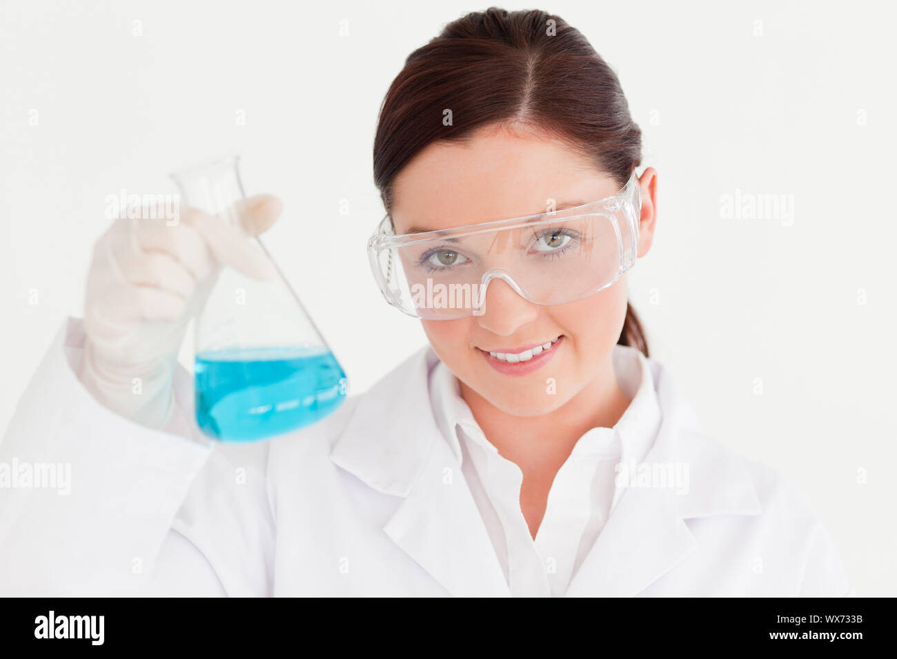 Pretty scientist looking at the camera in a laboratory Stock Photo - Alamy