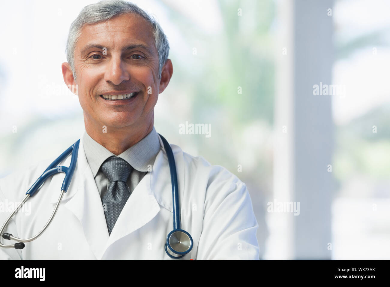 Doctor smiling in hospital Stock Photo - Alamy