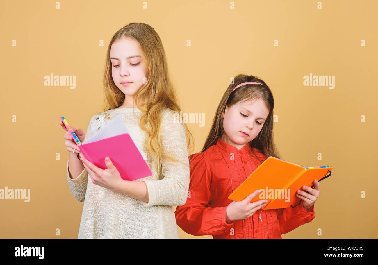 Kids girls with books or notepads. Education and kids literature ...