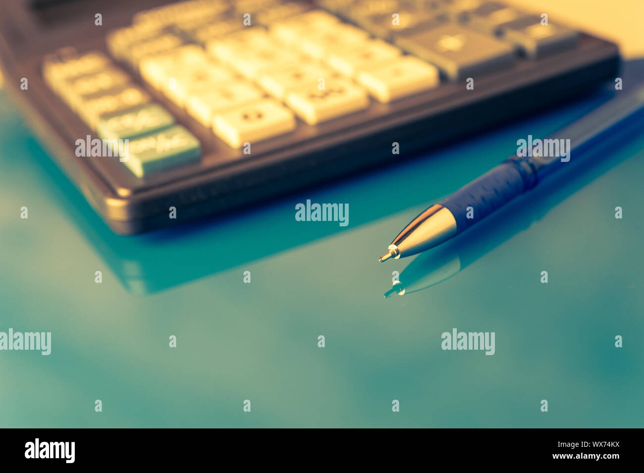 Business and financial background with pen and calculator. Bookkeeping ...