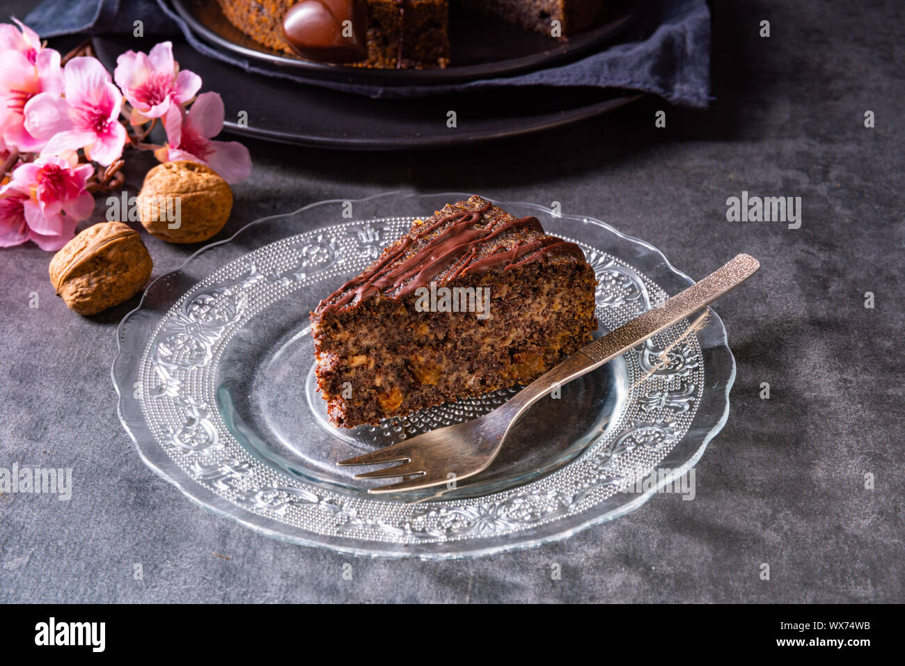 juicy poppy seed cake with apples and chocolate glaze Stock Photo - Alamy