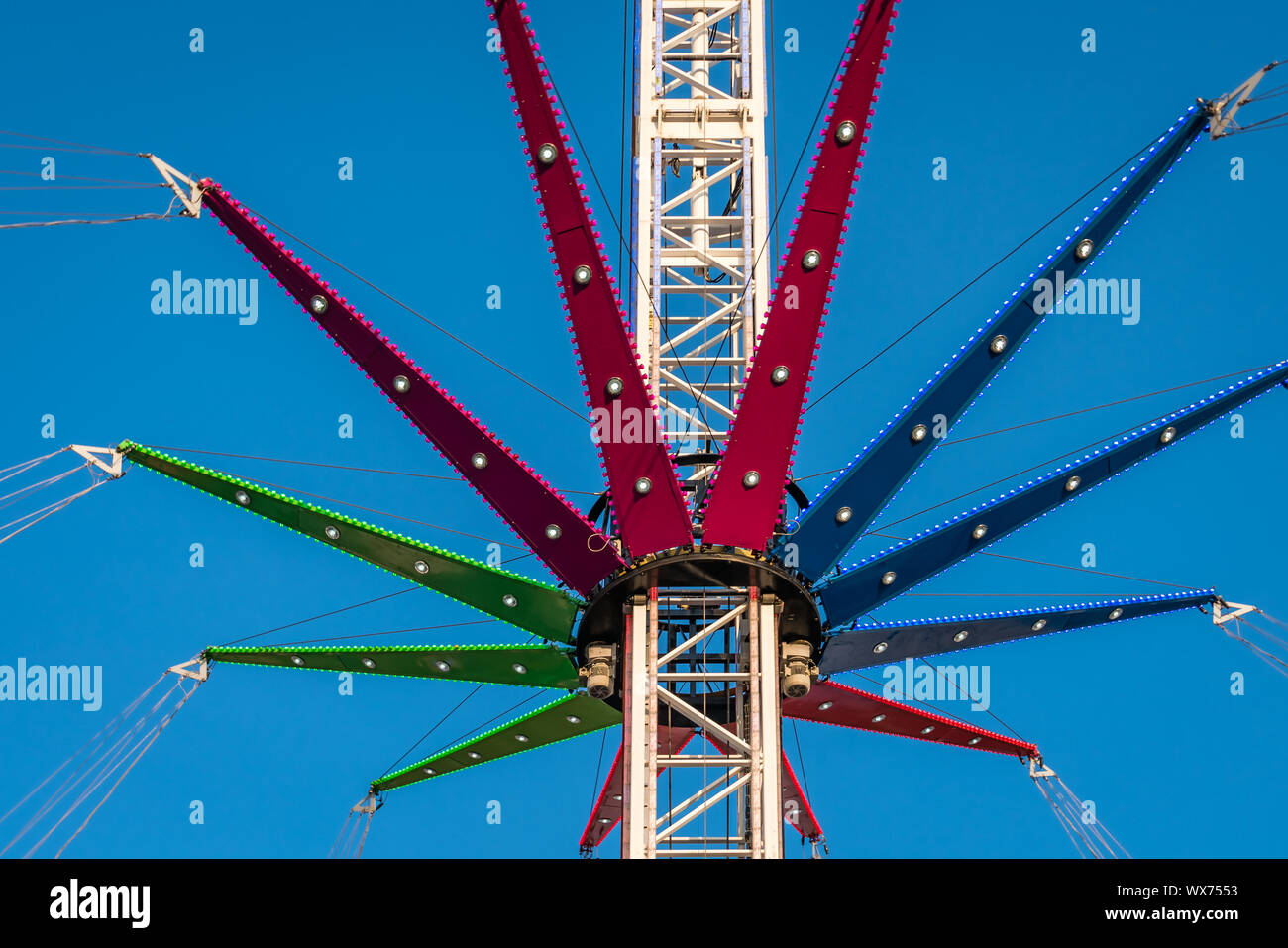 High exciting carousel ride on a funfair Stock Photo - Alamy