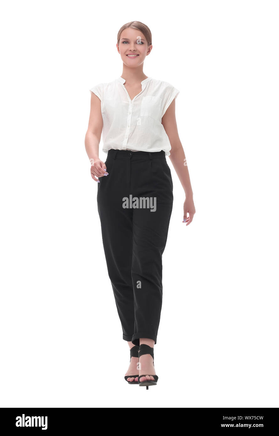 in full growth. confident young woman leader stepping forward. isolated ...