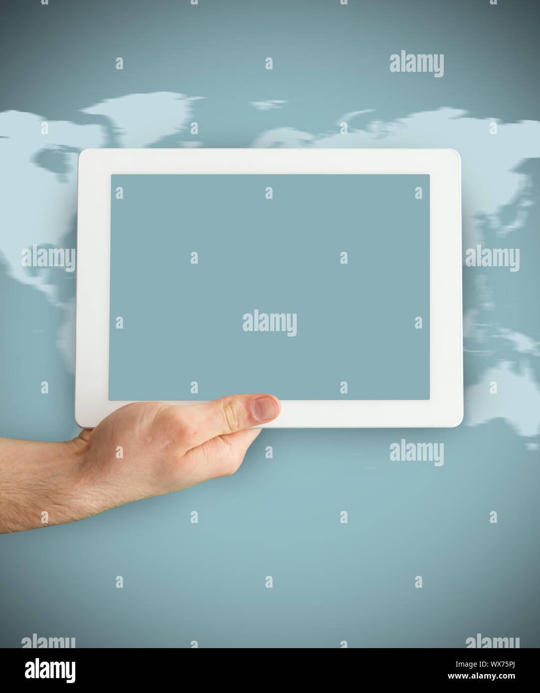 Hand holding tablet pc on world map background Stock Photo - Alamy