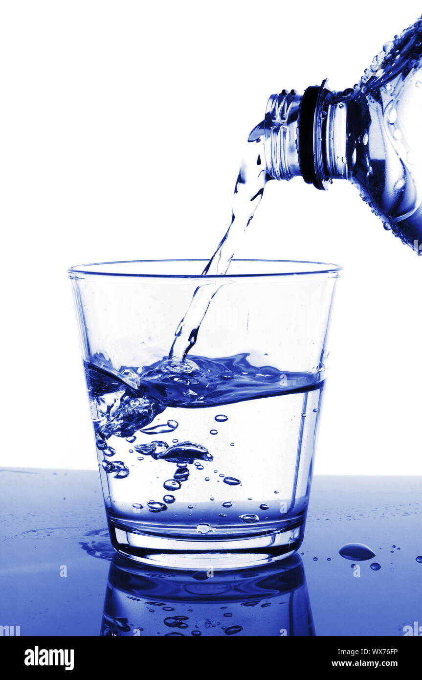 splashing water pouring in a glass with bubbles Stock Photo - Alamy