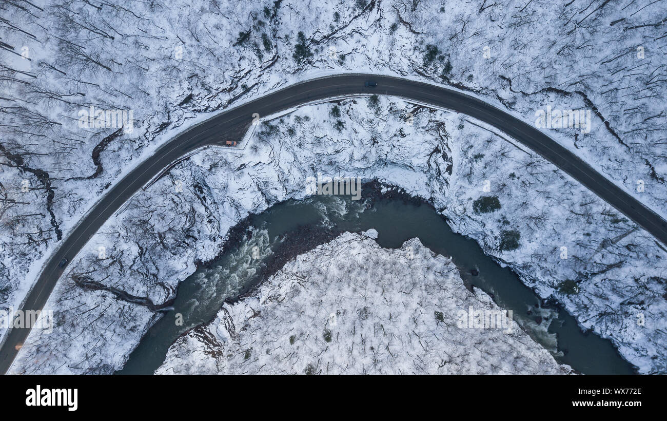 Aerial view of a mountain road covered in snow Stock Photo - Alamy